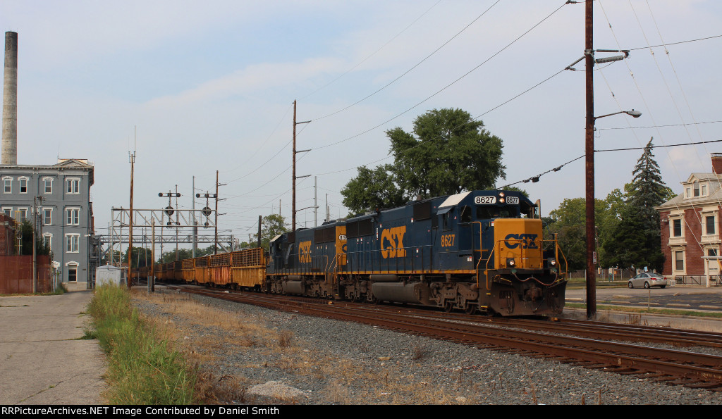 CSX 8627 leads a work train south-bound